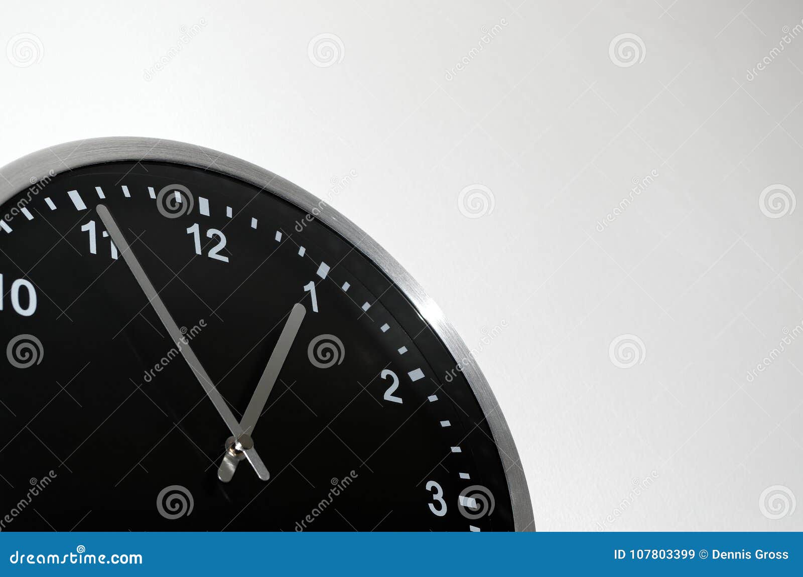 Five To One Setting on the Black Wall Clock Stock Image - Image of ...