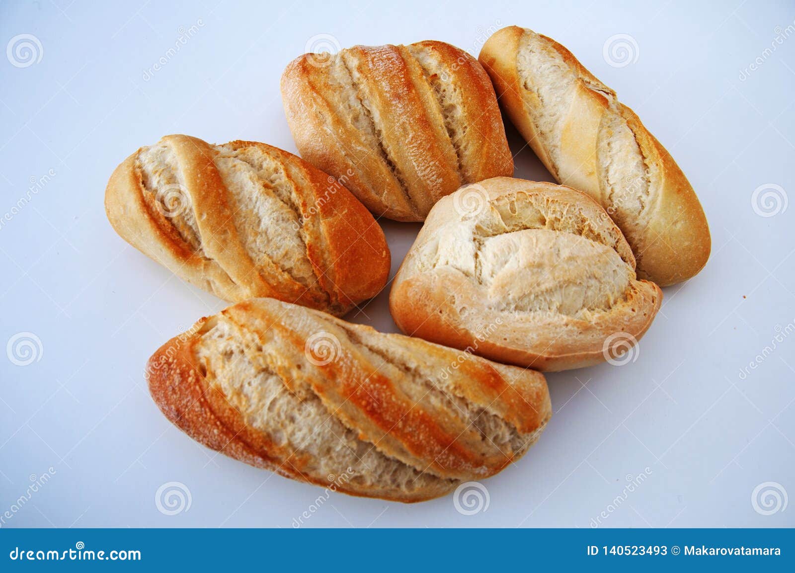 Five Toasted Small Breads on the White Background, Side View Stock ...