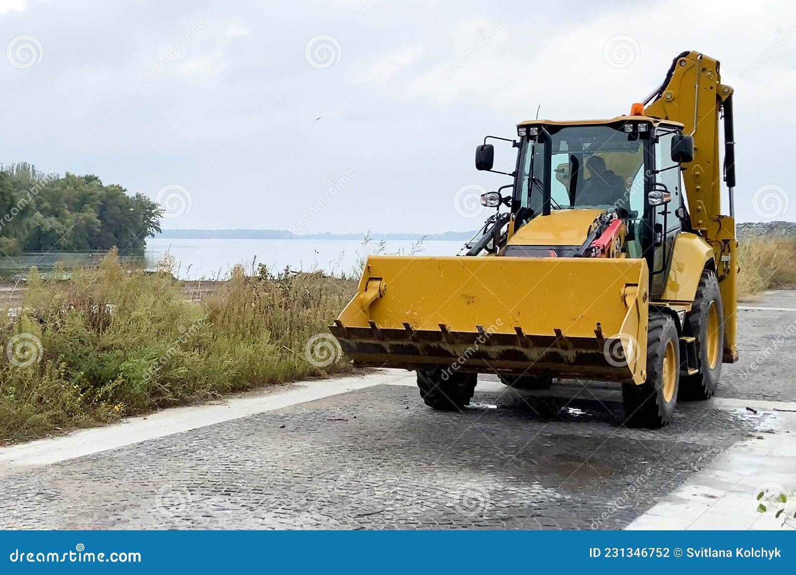 Bulldozer Bucket Close-up Digs A Pit For The Construction. The ...