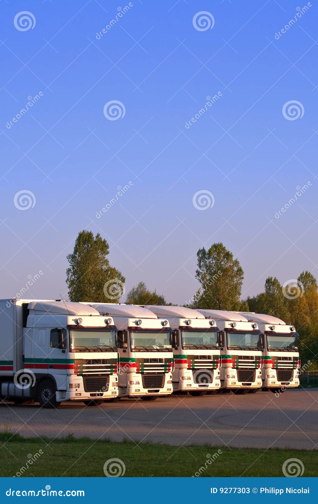 Five Trucks In A Row With Trees And Blue Sky Stock Image - Image of ...