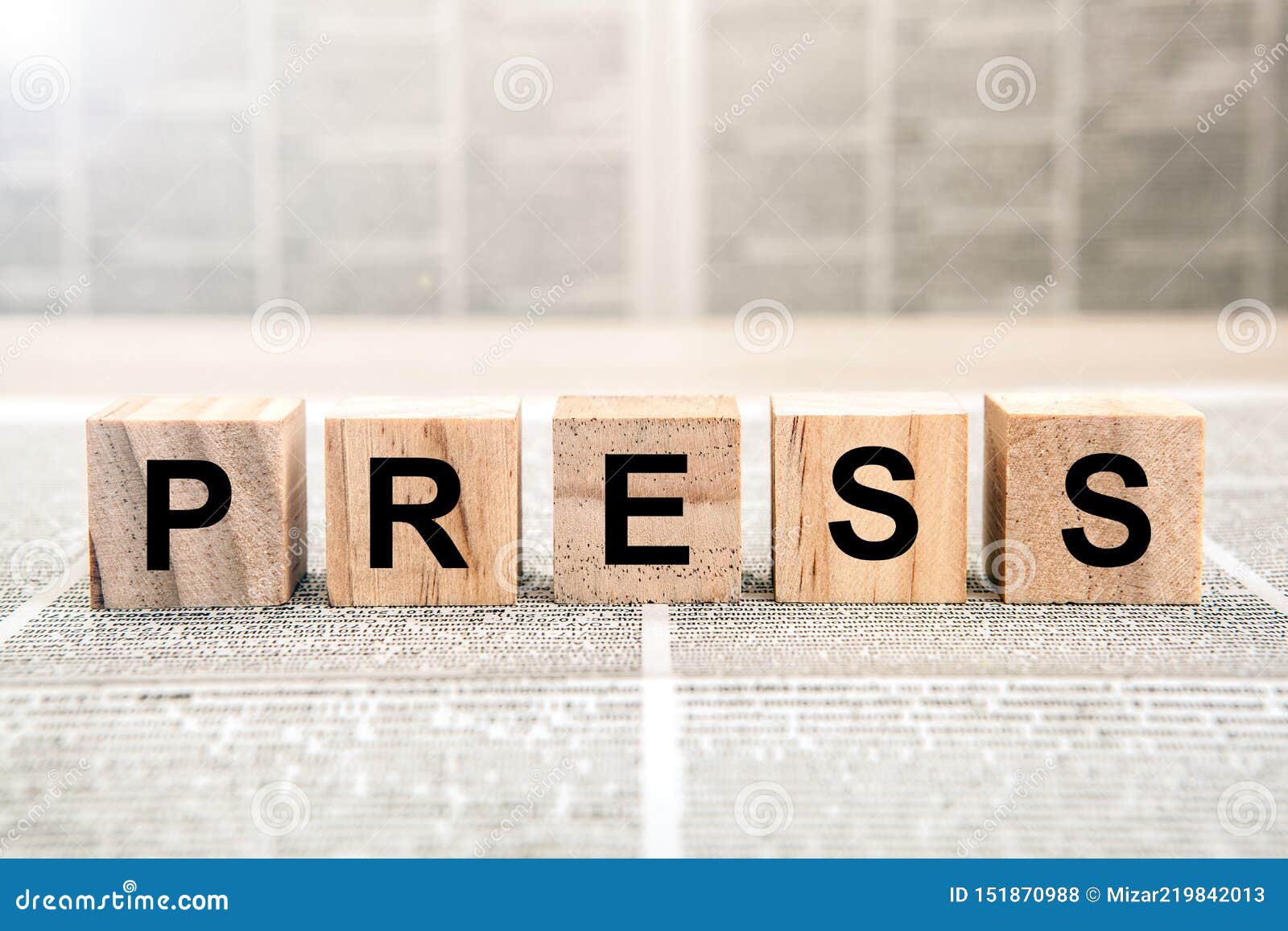 Five Wooden Cube Blocks with the Text Press on a Newspaper Background ...