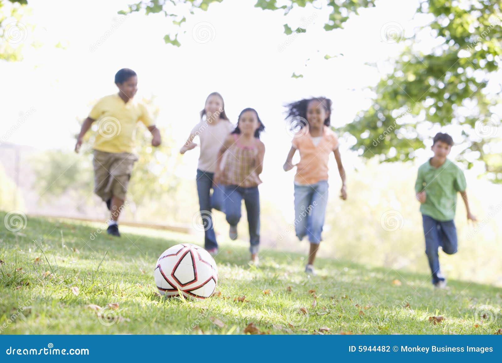 Five Young Friends Playing Soccer Stock Photo - Image of ethnic, kids ...