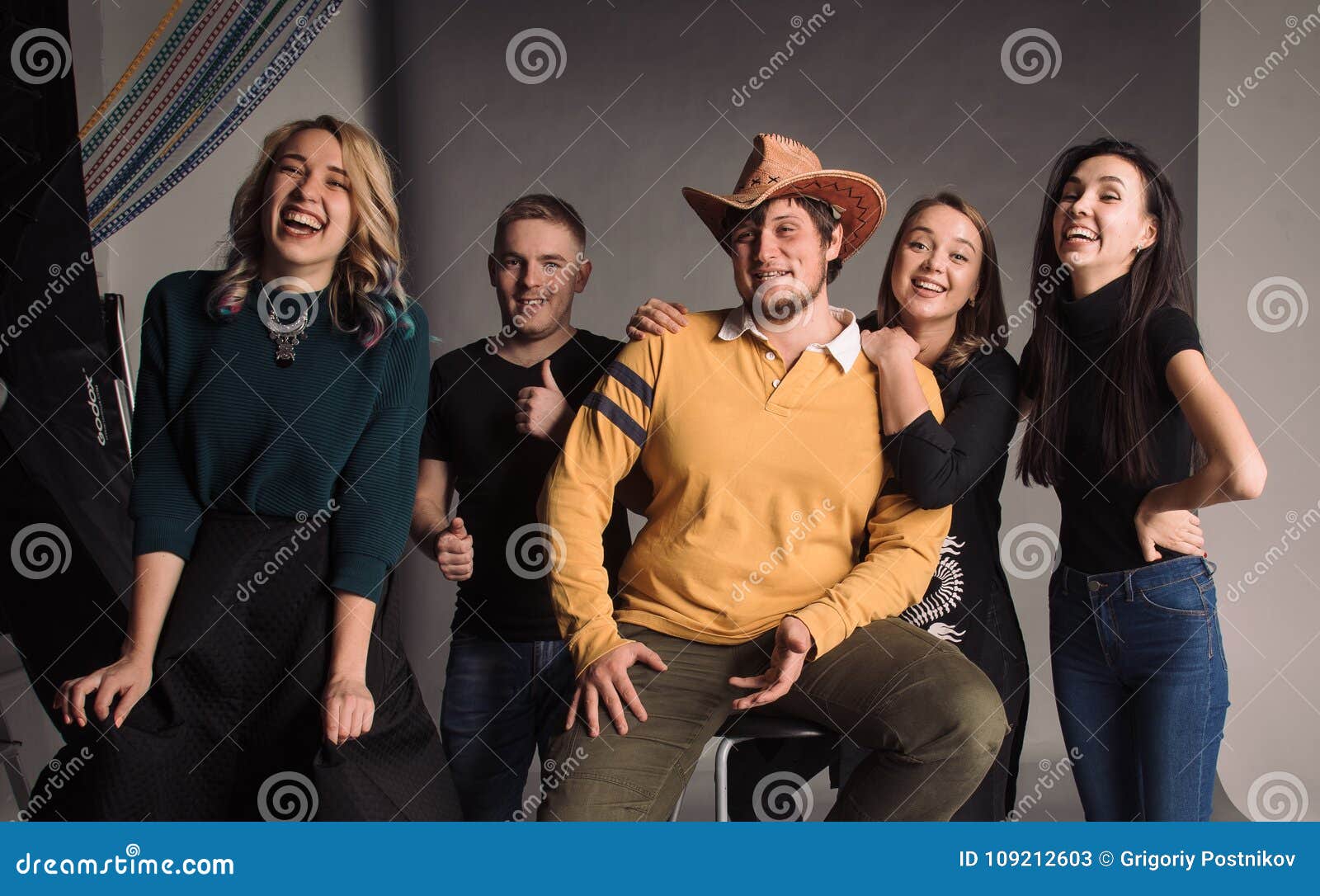 Five Cool Young Friends Standing Together and Smiling. the Studio Shot ...