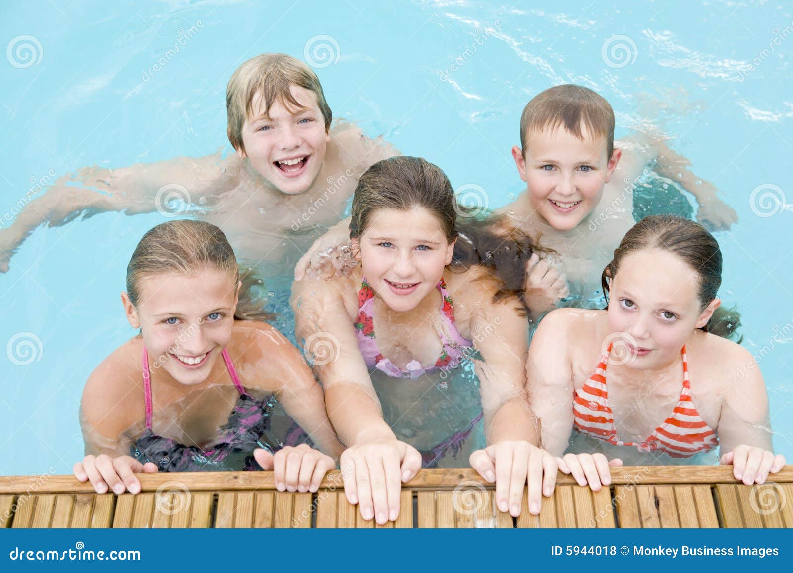 Five Young Friends in Swimming Pool Smiling Stock Photo - Image of ...