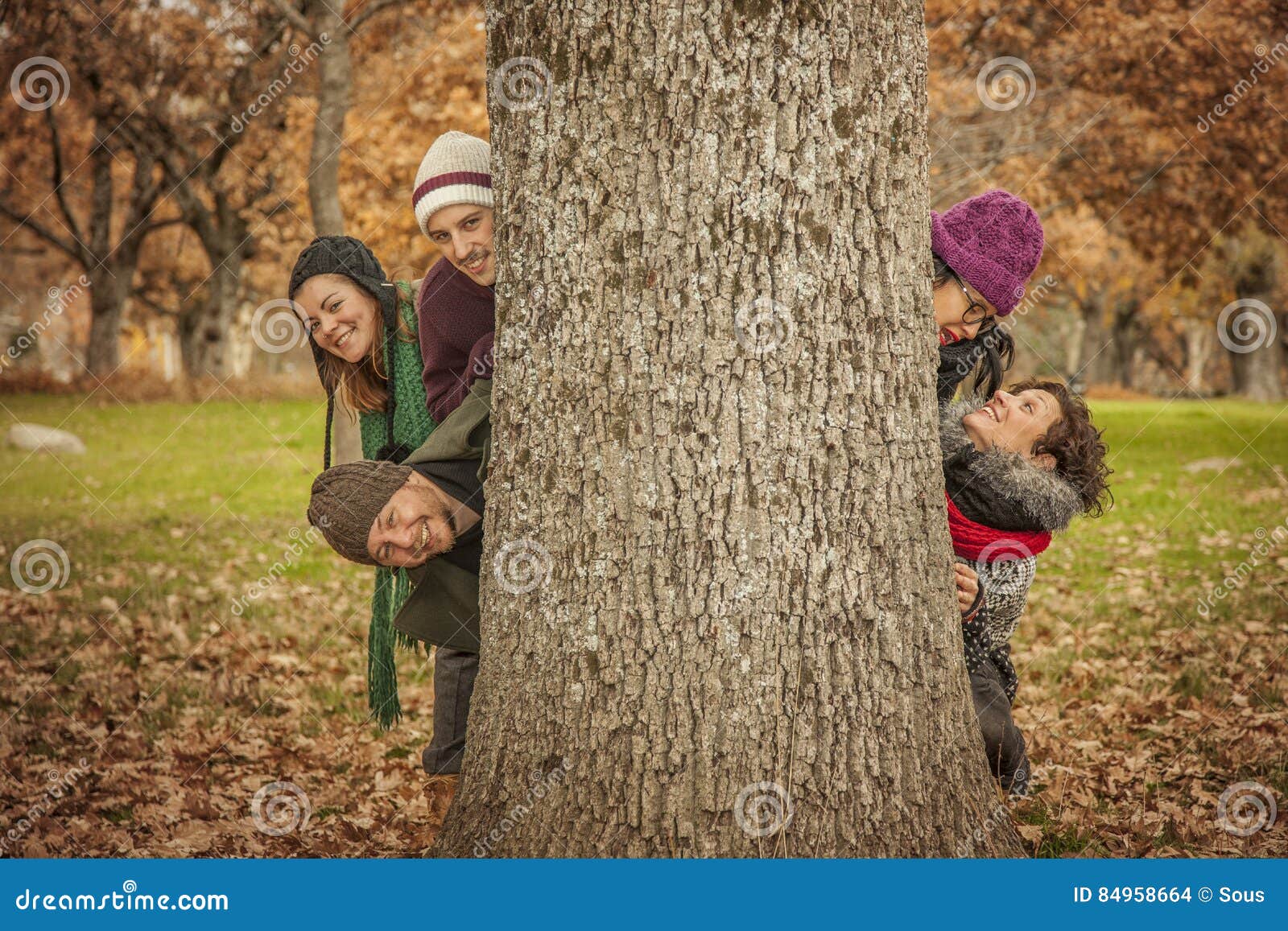 Five Young People Behind a Big Tree. Stock Photo - Image of cold ...