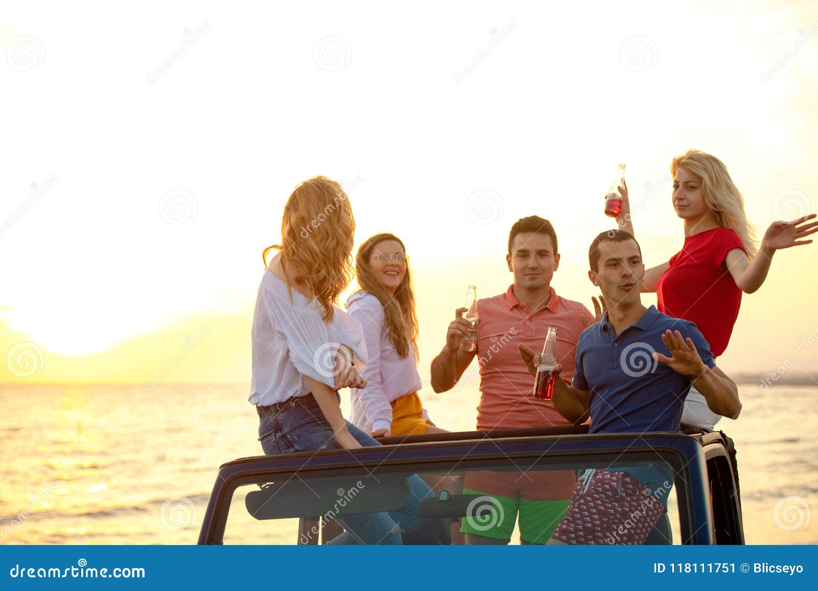 Five Young People Having Fun in Convertible Car at the Beach at Stock ...