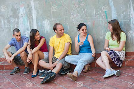 Five young people talking stock photo. Image of people - 25620424