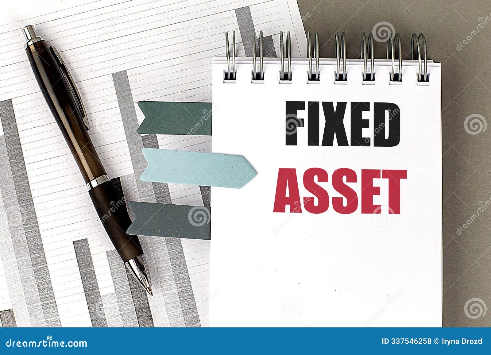 Fixed Asset Text on Notebook with Pen, Bar Charts, and Sticky Notes on ...