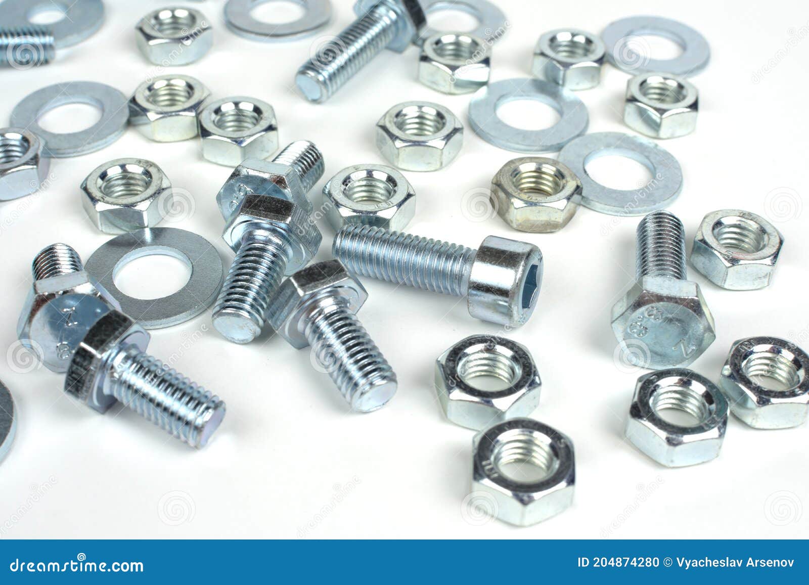 Bolts of Different Sizes with Nuts on a White Background Stock Photo ...