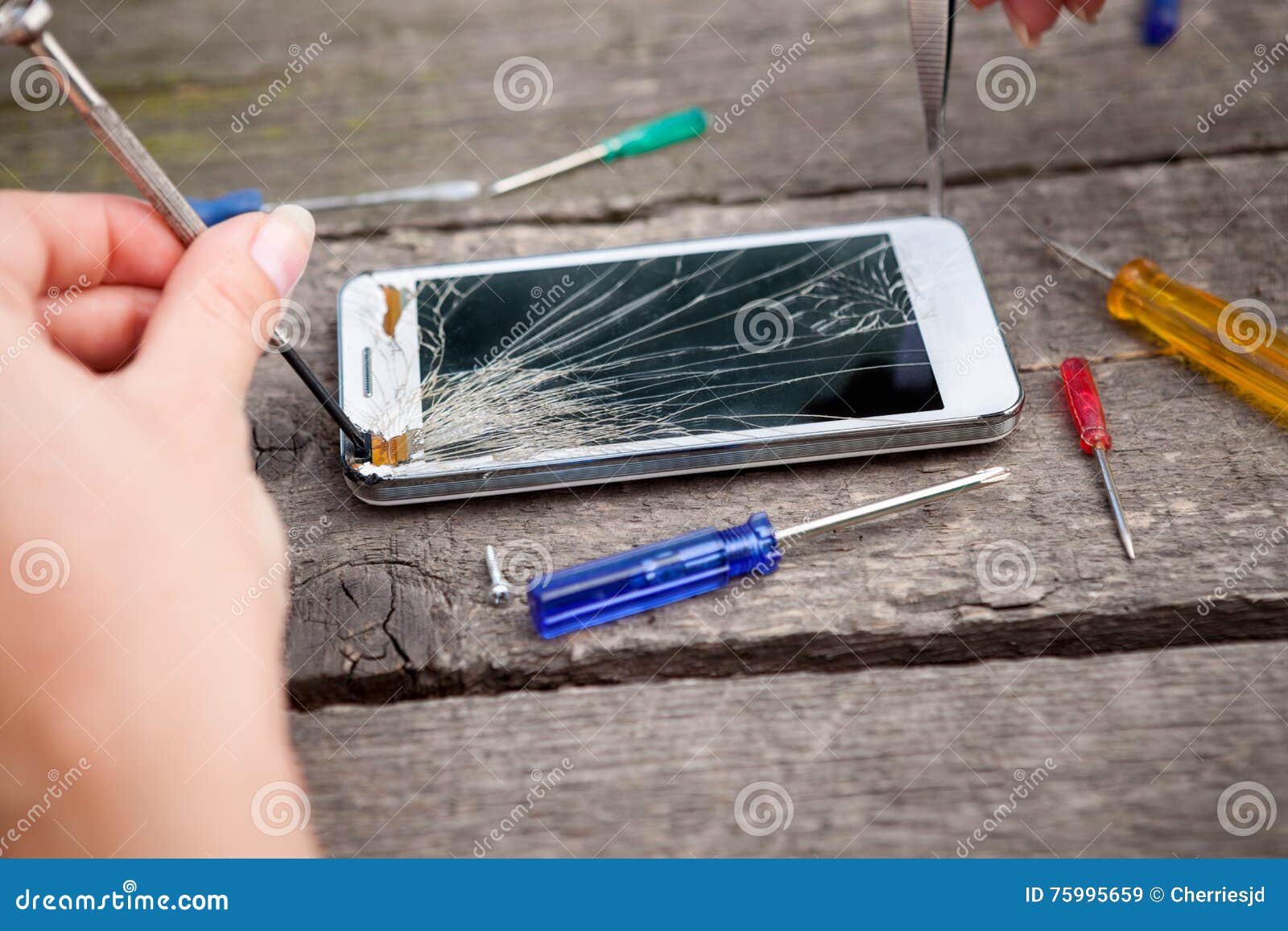 Fixing damaged smartphone stock image. Image of destroyed - 75995659