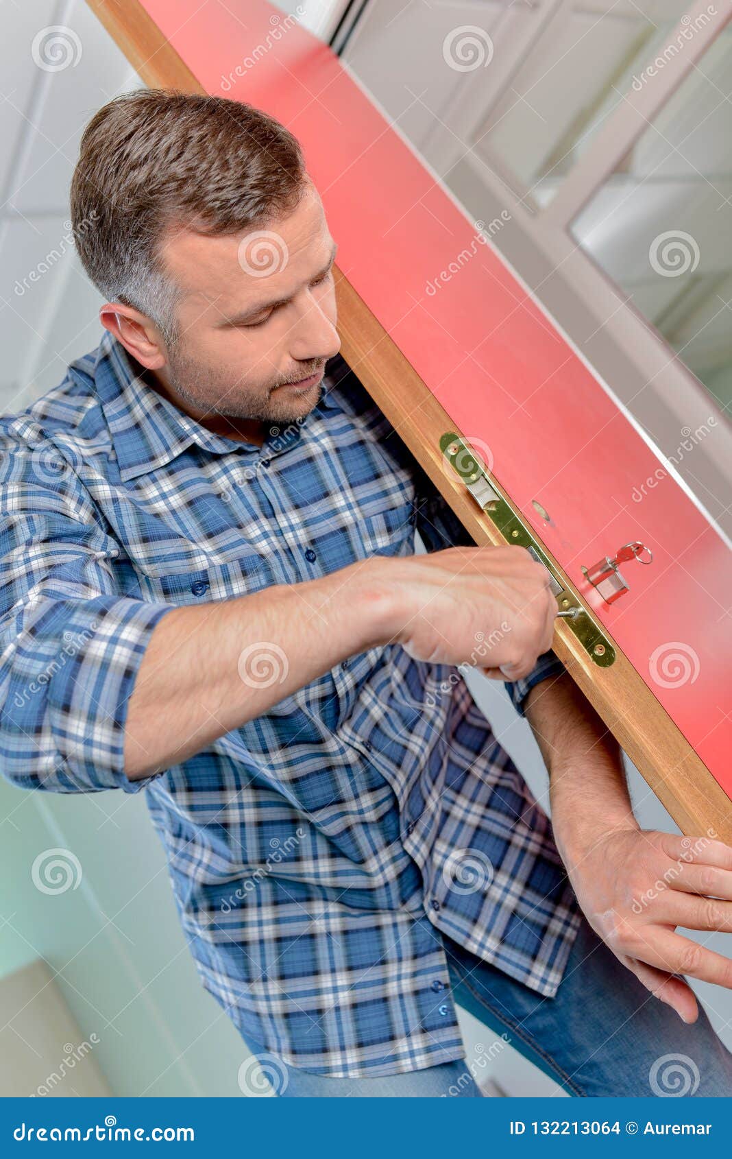 Fixing a door lock stock photo. Image of mechanical - 132213064