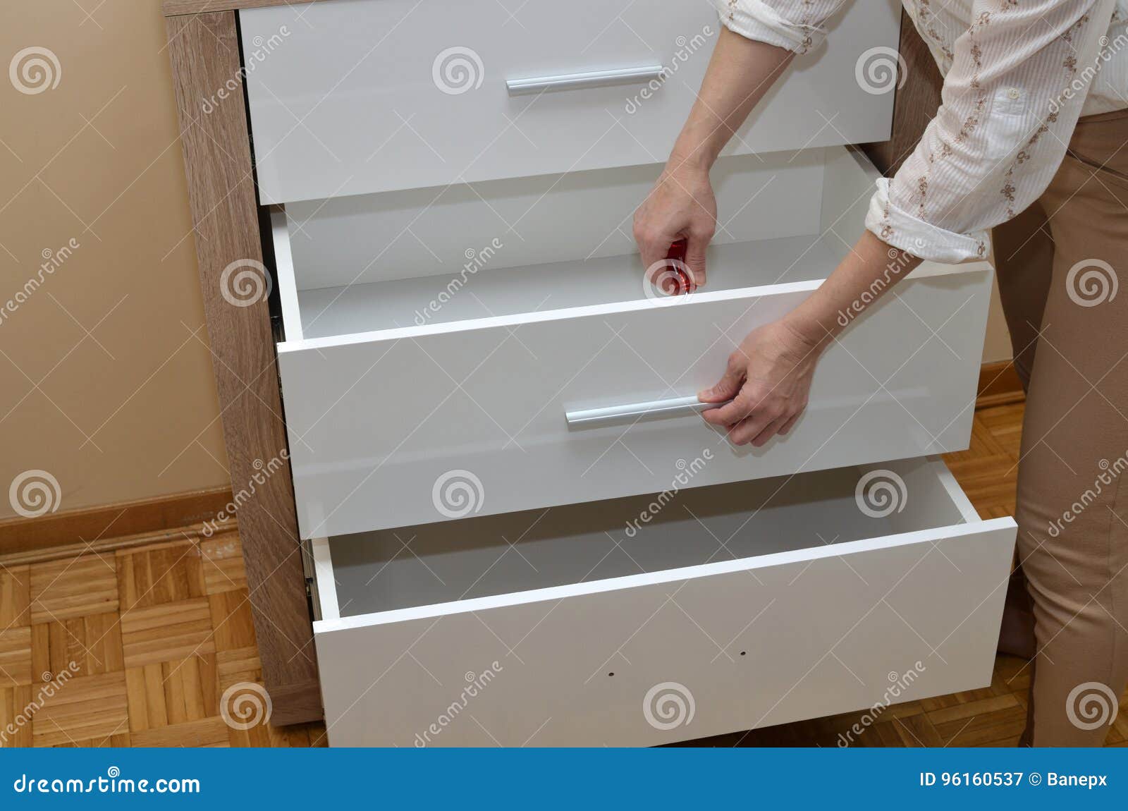 Fixing Drawer Handle stock image. Image of construction - 96160537