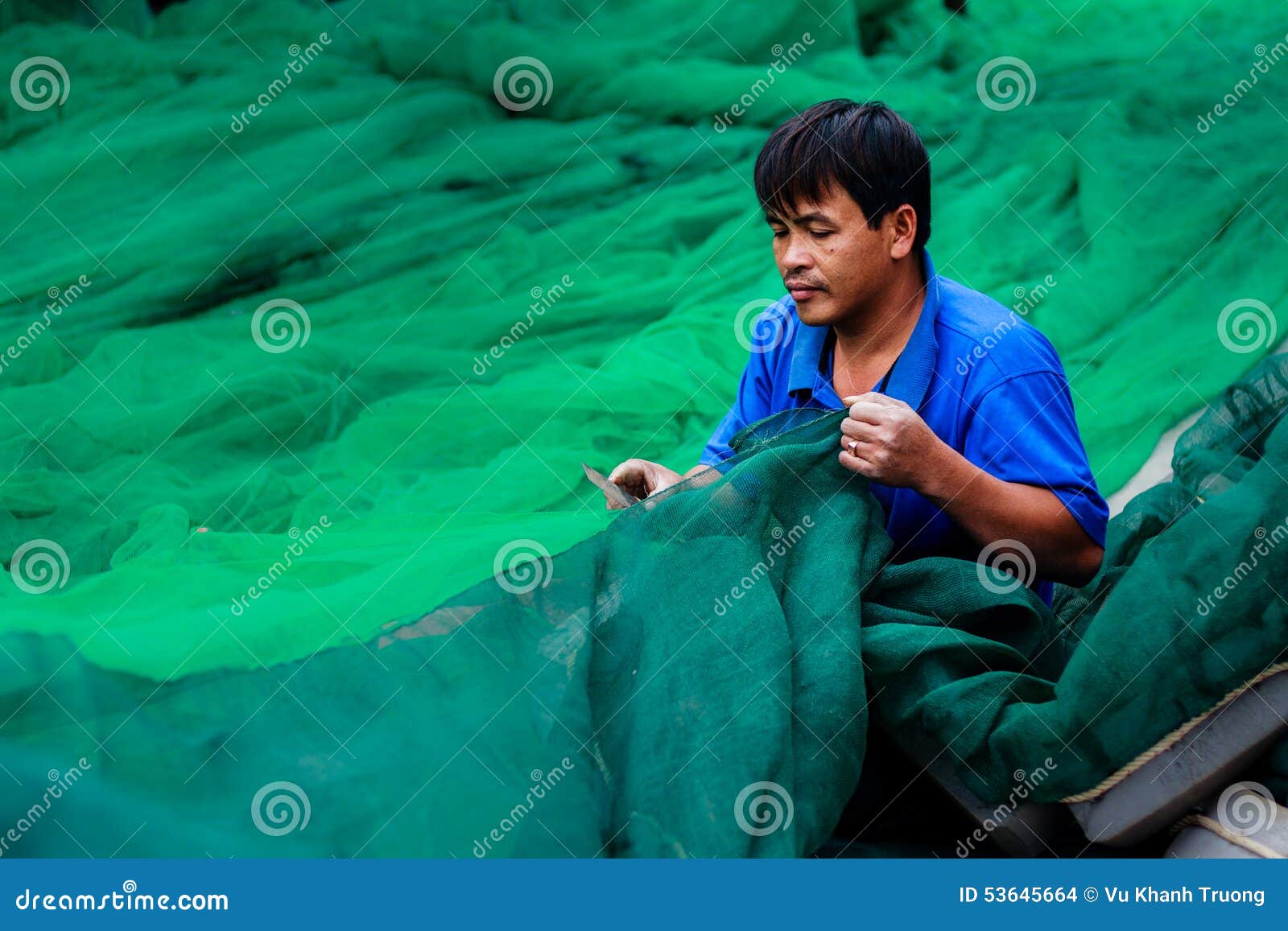 Fixing the fish net editorial stock image. Image of fixing - 53645664
