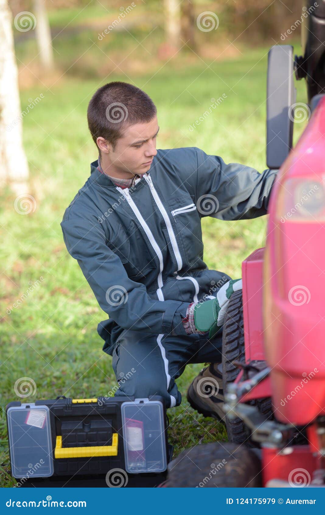 Fixing the garden tractor stock image. Image of technician - 124175979