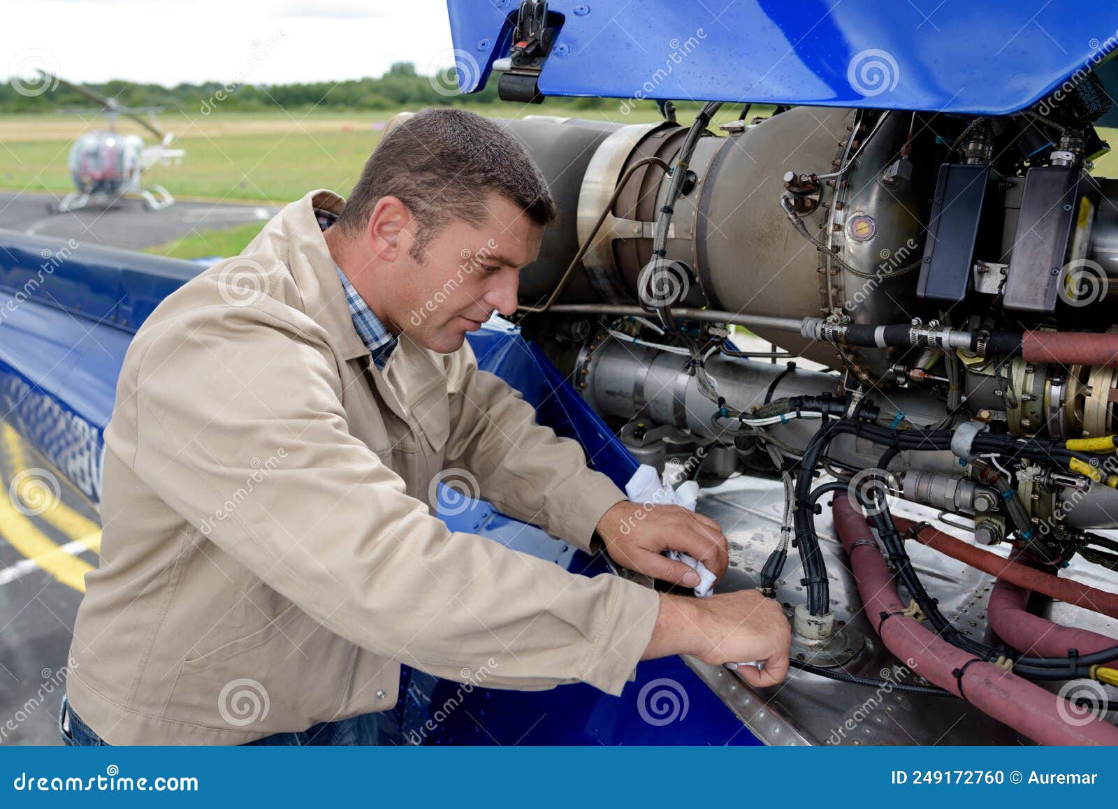He Fixing Helicopter Outdoors Stock Photo - Image of camo, hydraulic ...
