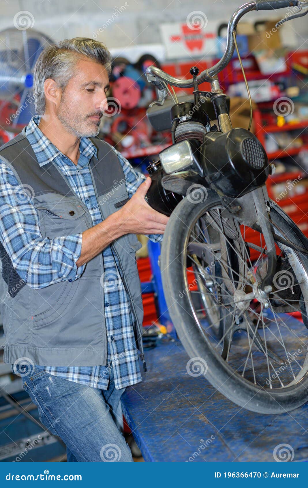 He fixing motorbike stock photo. Image of fixing, technician - 196366470