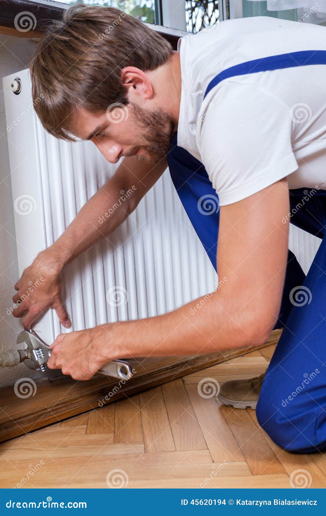 Fixing radiator at home stock photo. Image of repair - 45620194