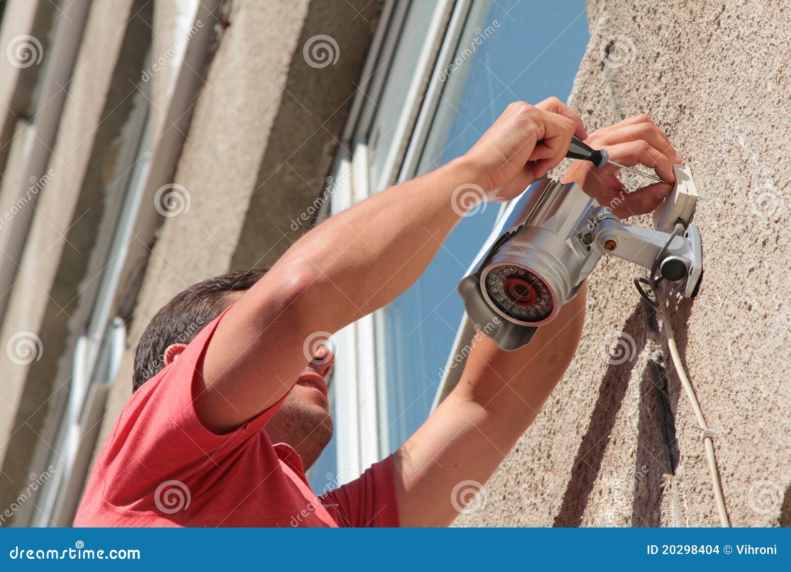 Fixing the security camera stock photo. Image of working - 20298404