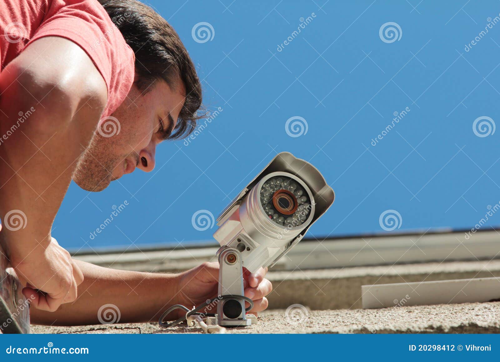 Fixing the security camera stock photo. Image of blue - 20298412