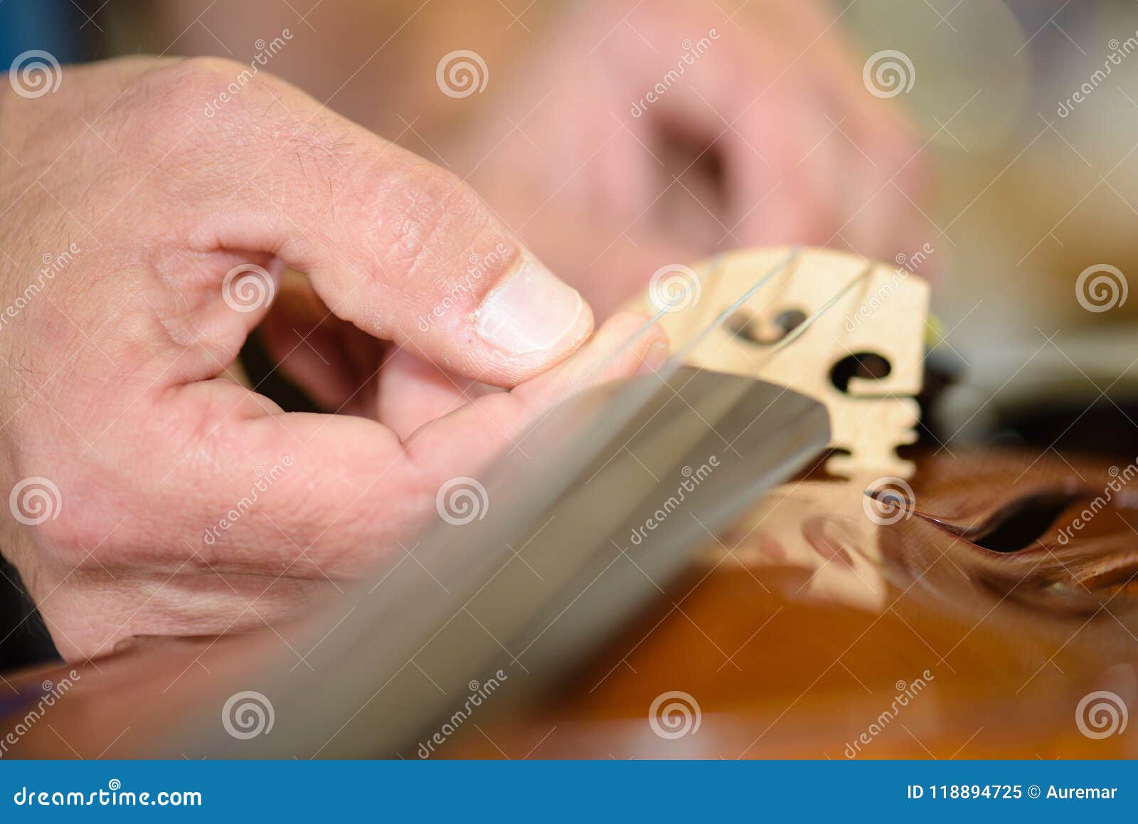 Fixing a string instrument stock image. Image of music - 118894725