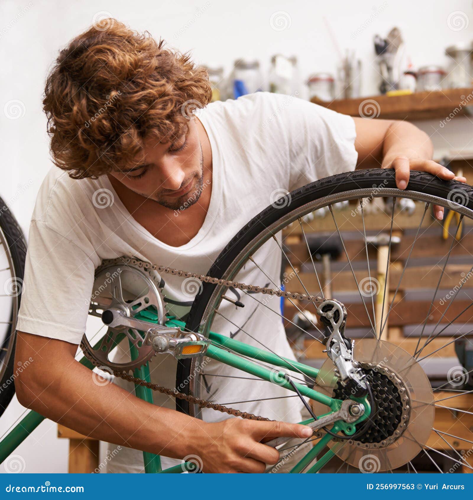 Fixing Things is What I Do Best. a Young Man Fixing a Bicycle. Stock ...