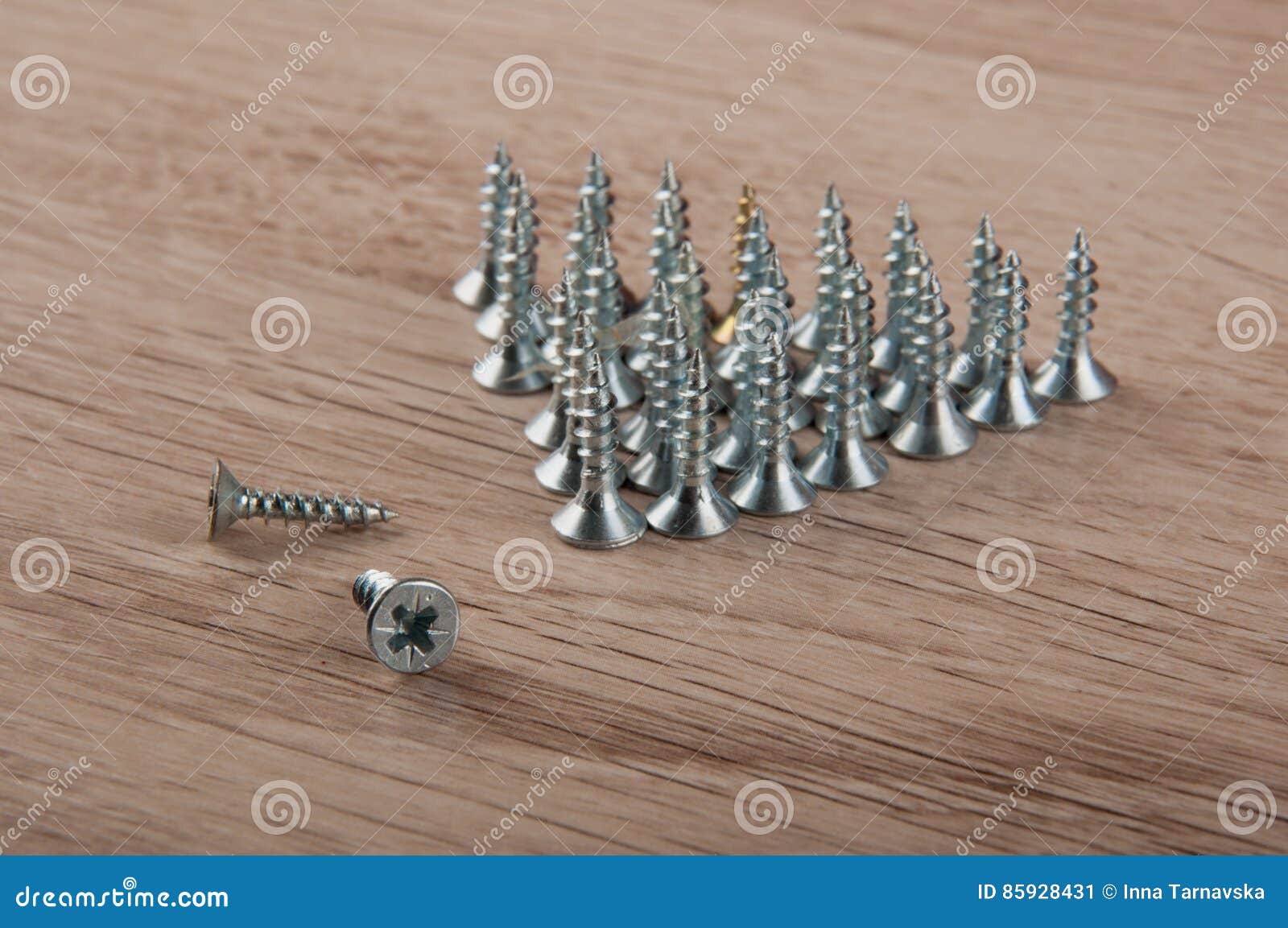 Fixing Tools. Metallic Screws Lay on Wooden Table Stock Image - Image ...