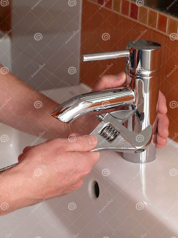 Fixing water tap stock image. Image of plumbing, faucet - 25653077
