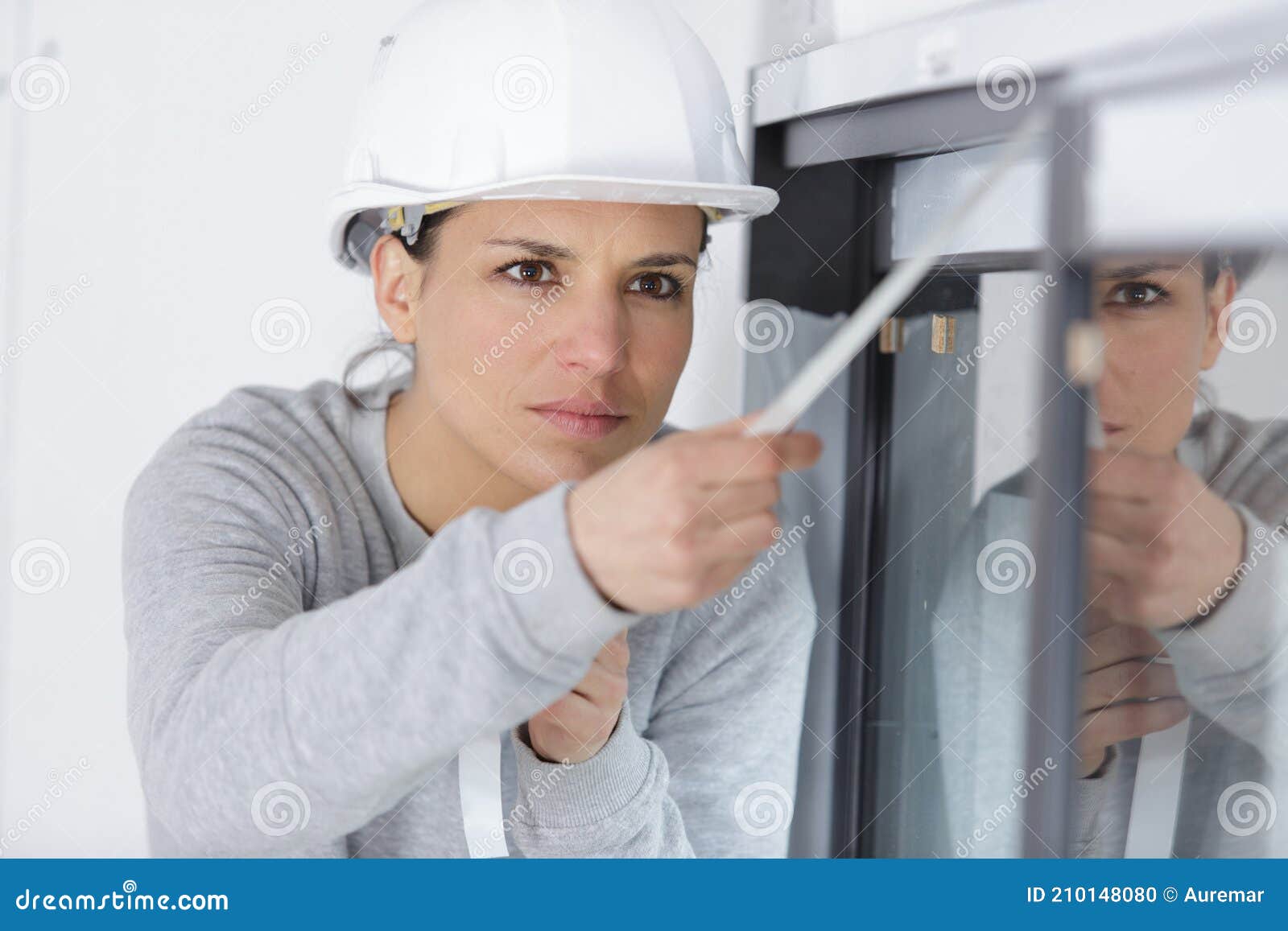 Fixing the window blinds stock photo. Image of technician - 210148080