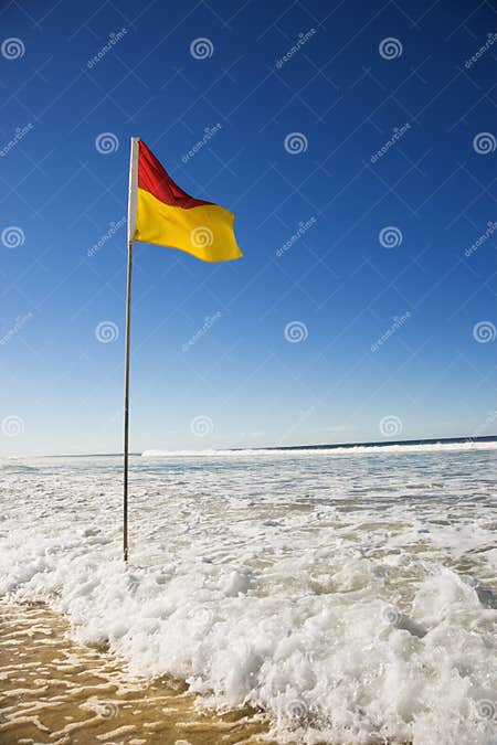 Flag on beach. stock photo. Image of queensland, color - 4485196