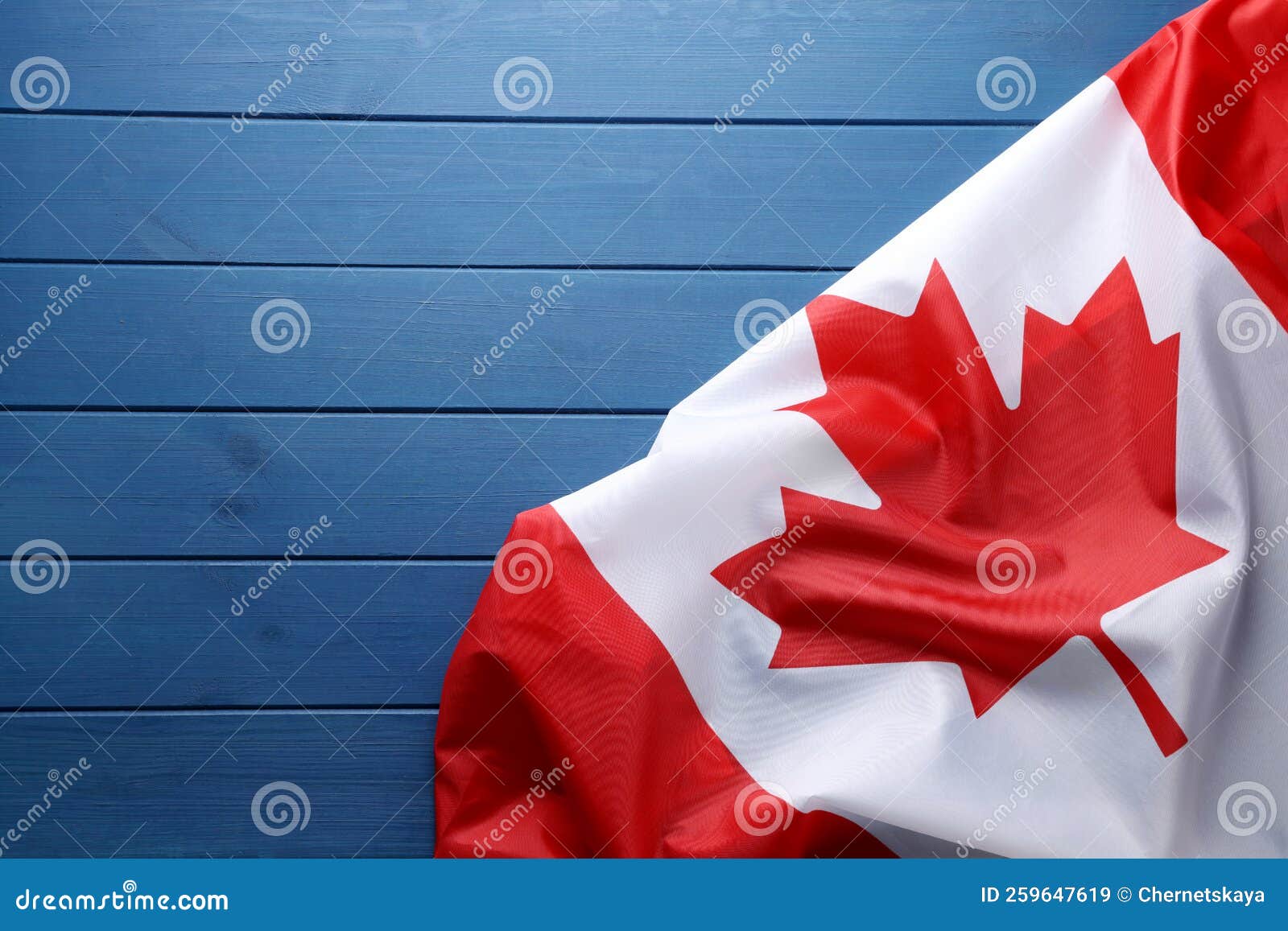Flag of Canada on Blue Wooden Table, Top View. Space for Text Stock ...