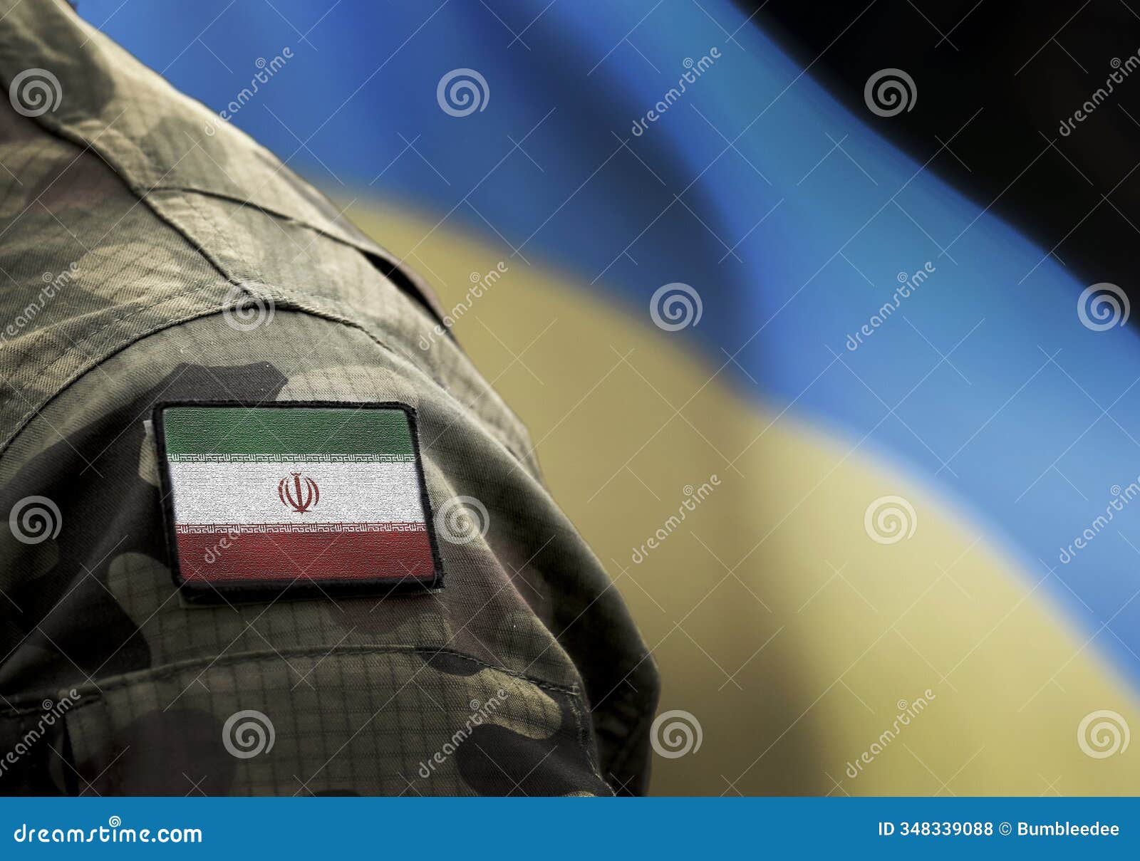Flag of Iran on Military Uniform and Flag of the Ukraine at Background ...