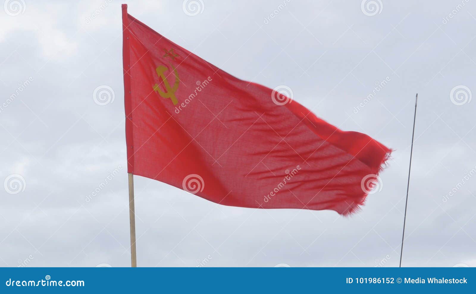The Flag of the USSR Developing in the Wind on a Flagpole in a Windy ...