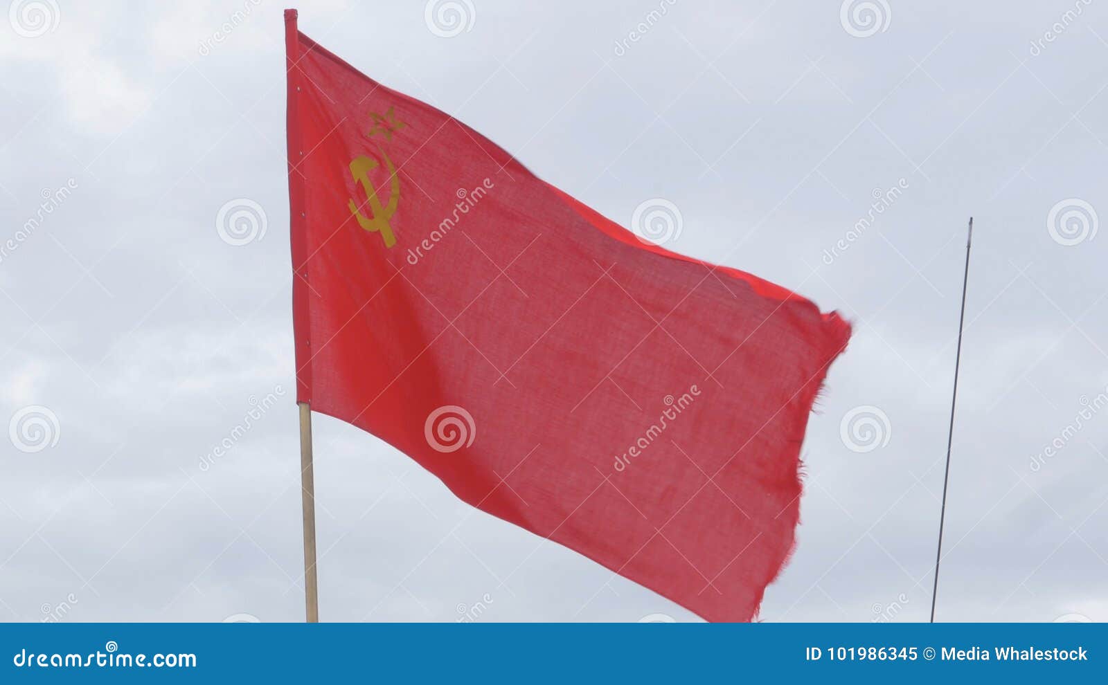 The Flag of the USSR Developing in the Wind on a Flagpole in a Windy ...