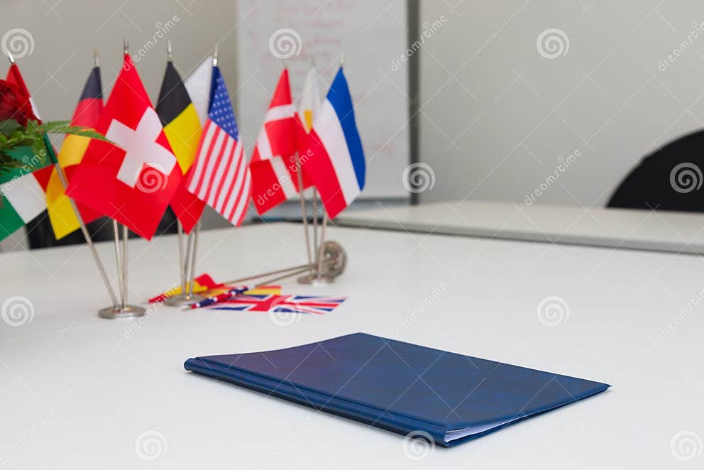 Flags of Different Countries on the Background of the White Tabl Stock ...