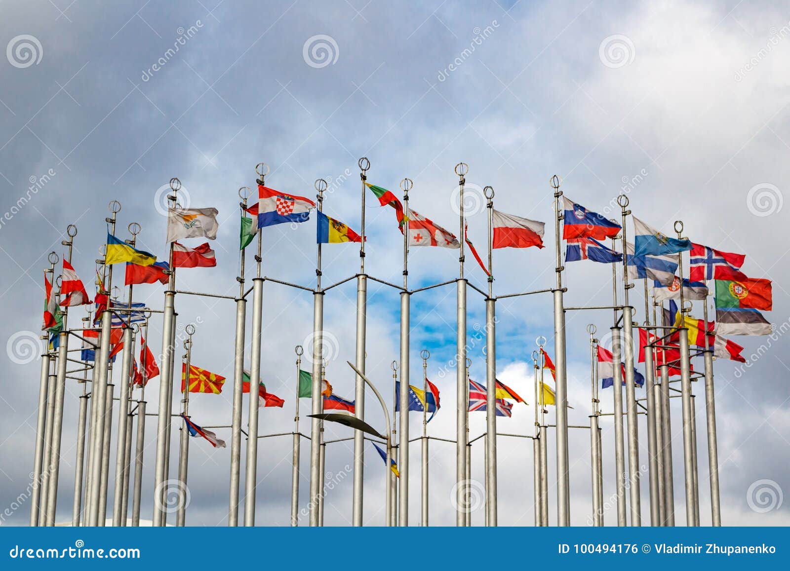 Flags of Different Countries on Cloudy Sky Background Stock Photo ...