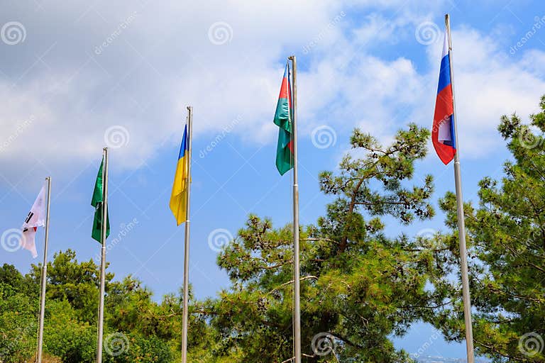 Flags of Different Countries on Poles, Selective Focus. Background with ...