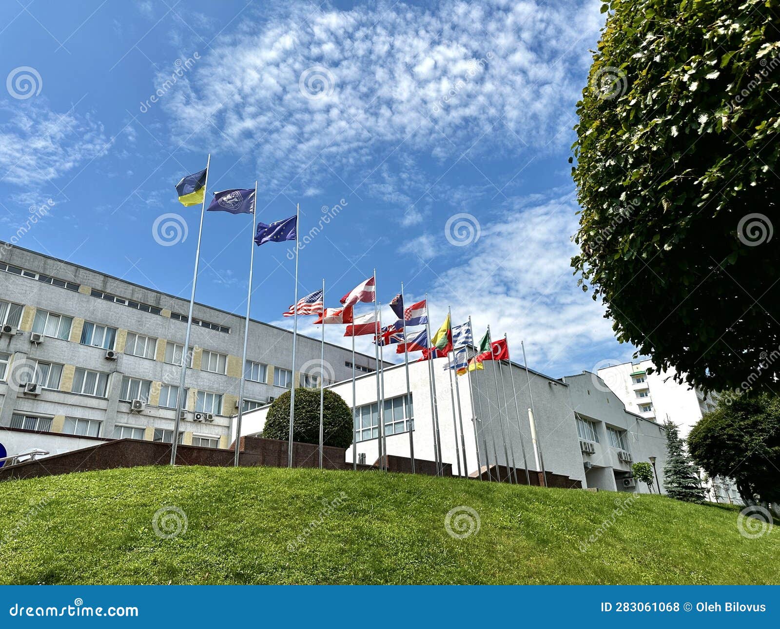 Flags of Different Countries Together on Flagpoles Stock Photo - Image ...