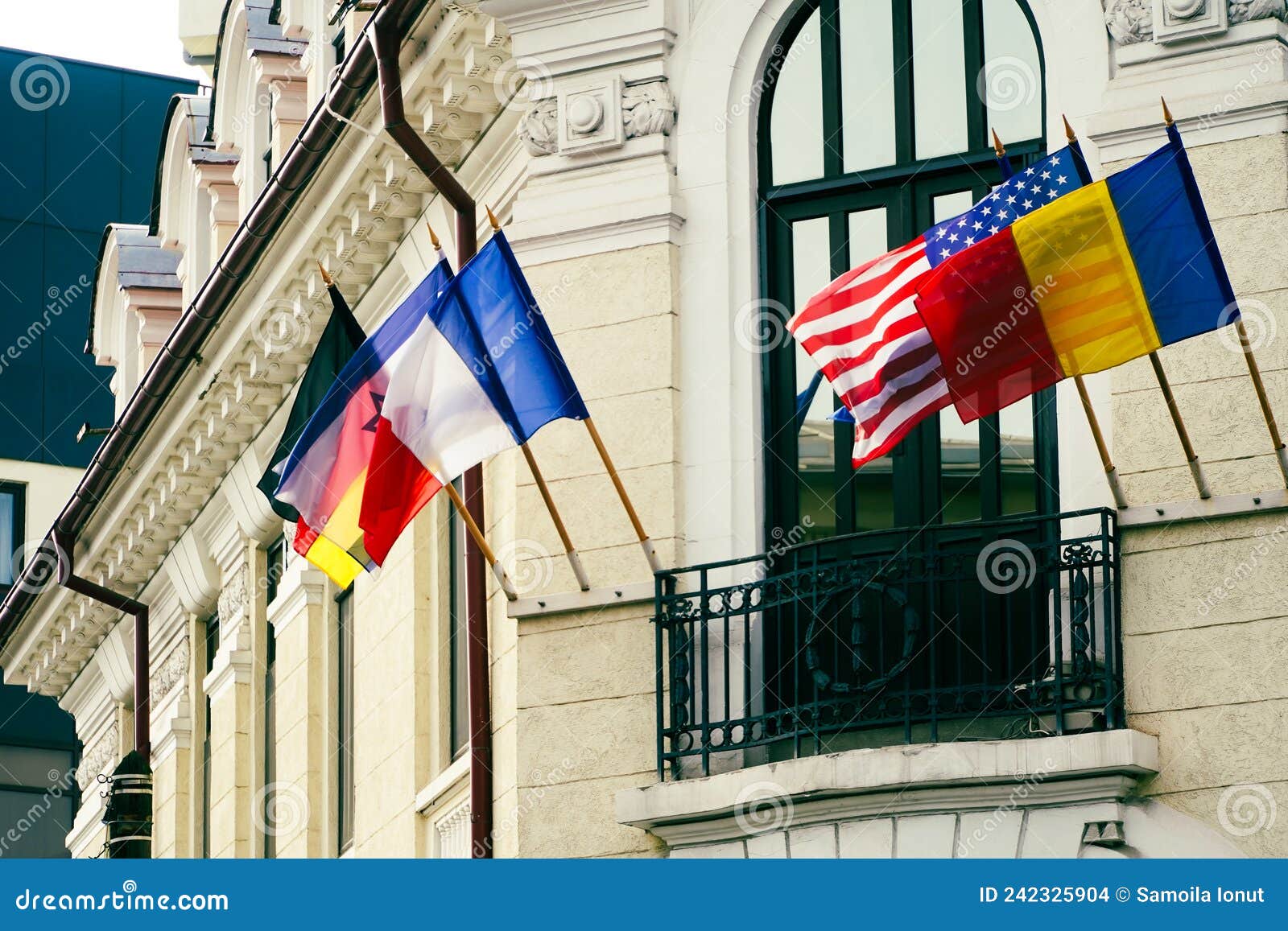 Flags Hoisted on the Facade of a Building. Photo during the Day. Stock ...