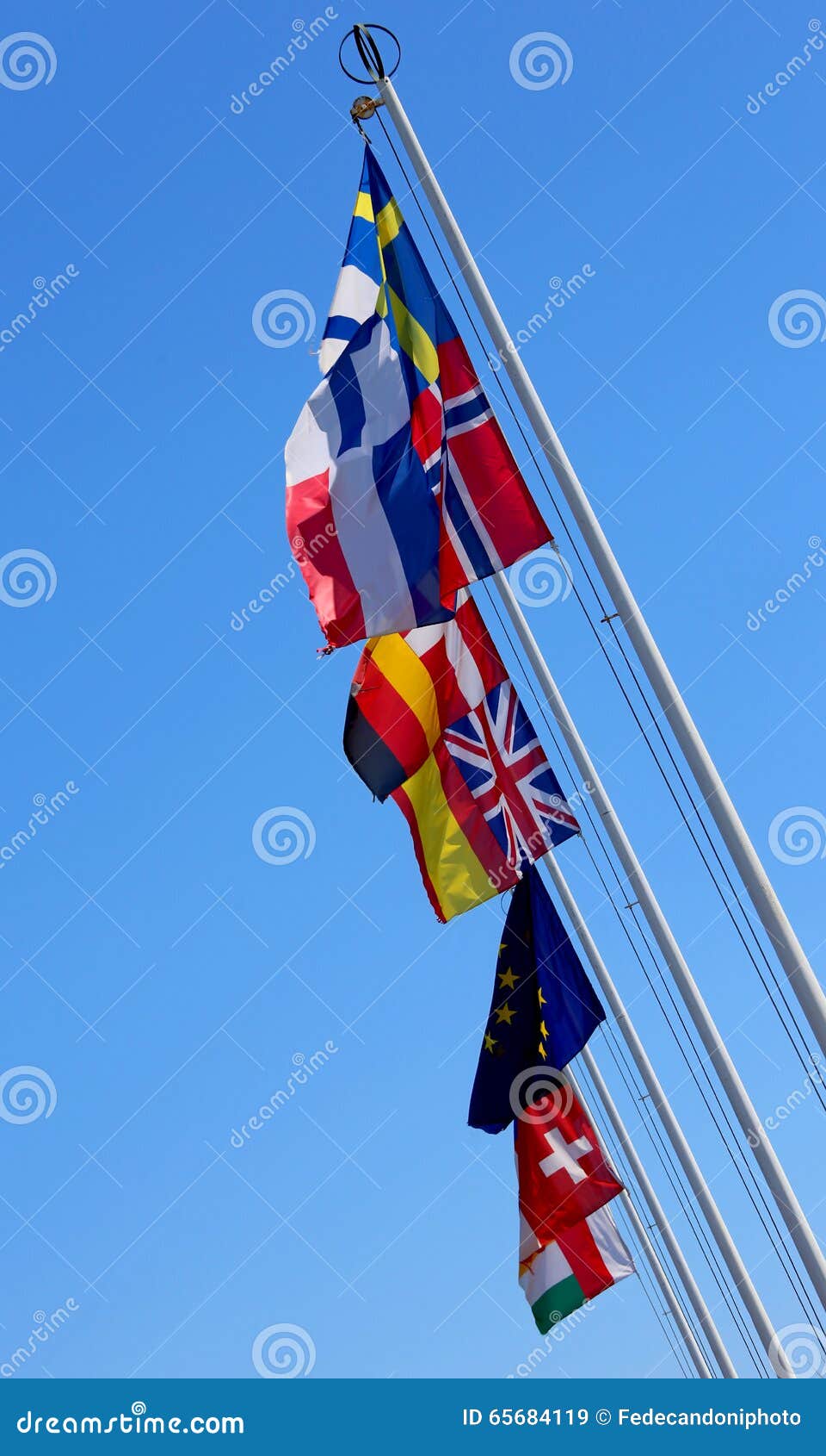 Flags of Many Nations World Waving in the Blue Sky Stock Image - Image ...