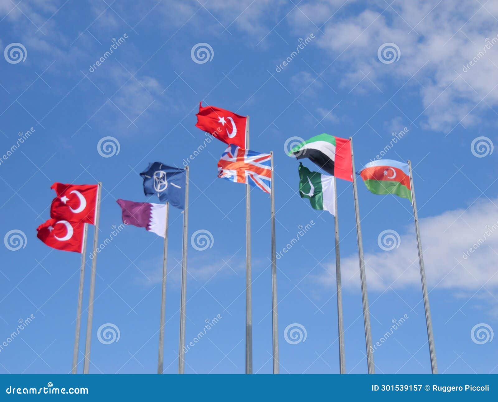 Flags of Various Islamic Countries and NATO Against Blue Sky Stock ...