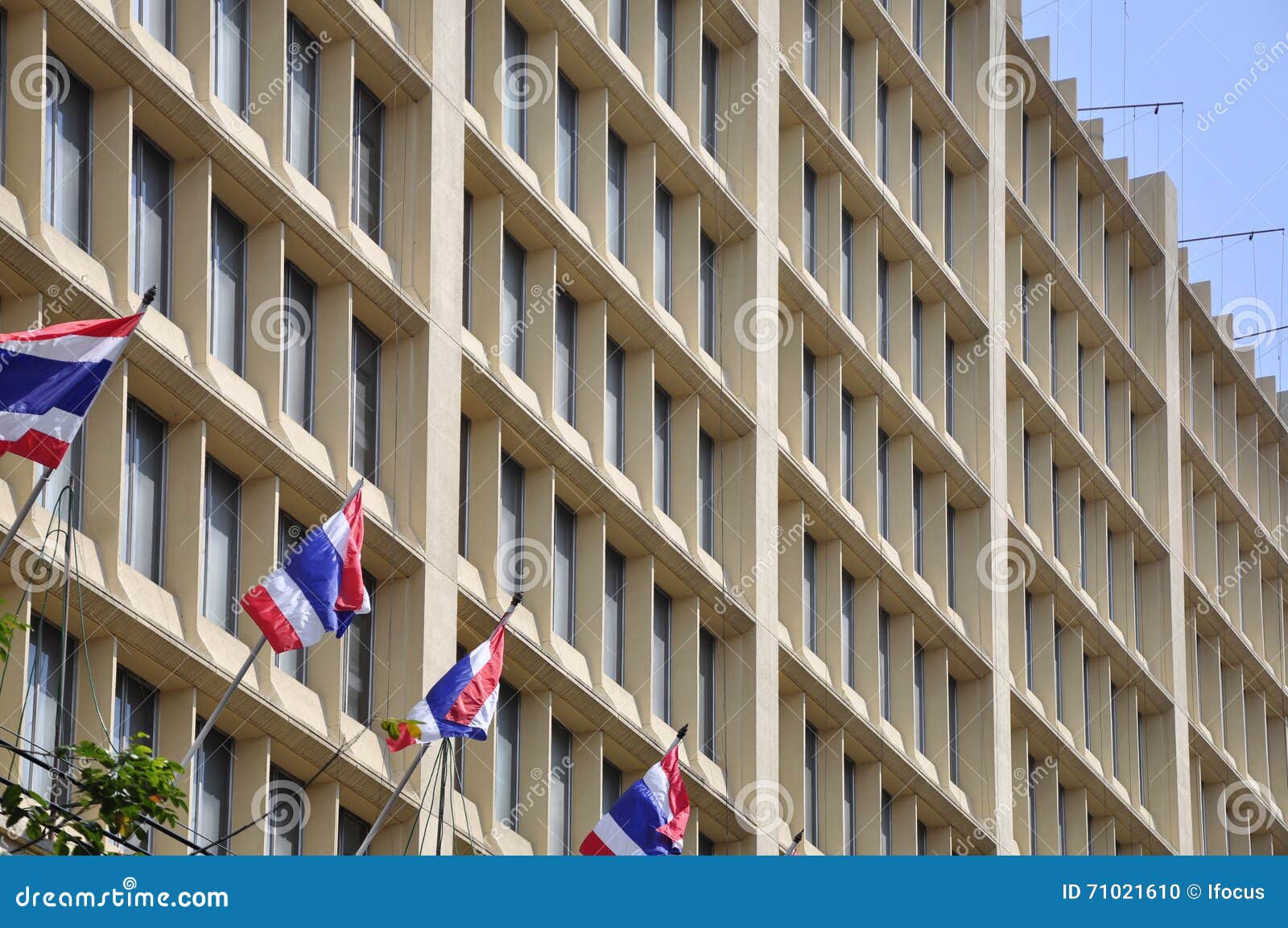 Flags Waving on a Building Facade Stock Photo - Image of flags ...