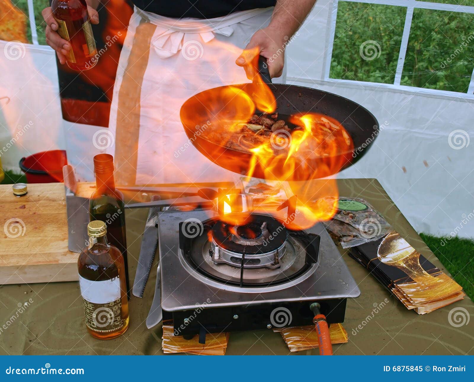 Flambe cook in flames stock image. Image of ethnicity - 6875845