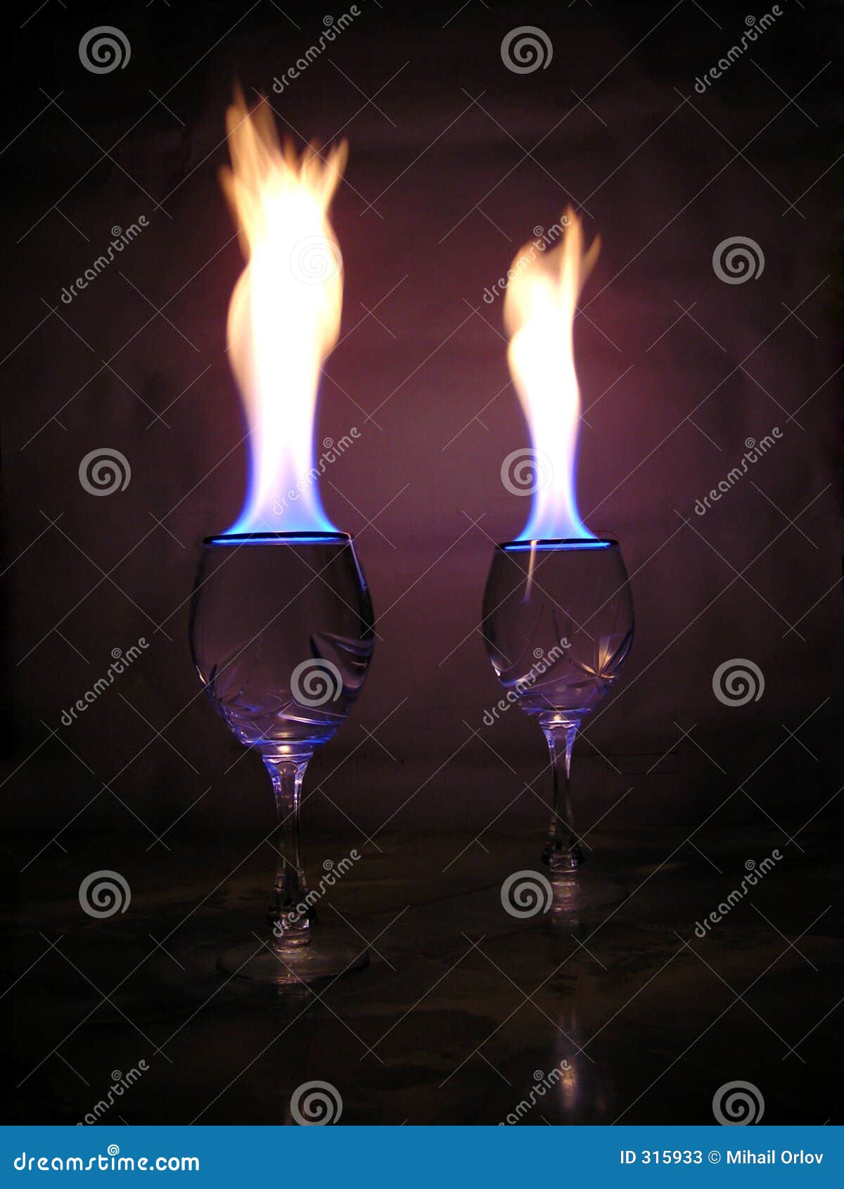 Flame above glasses. stock image. Image of reflection, fire - 315933