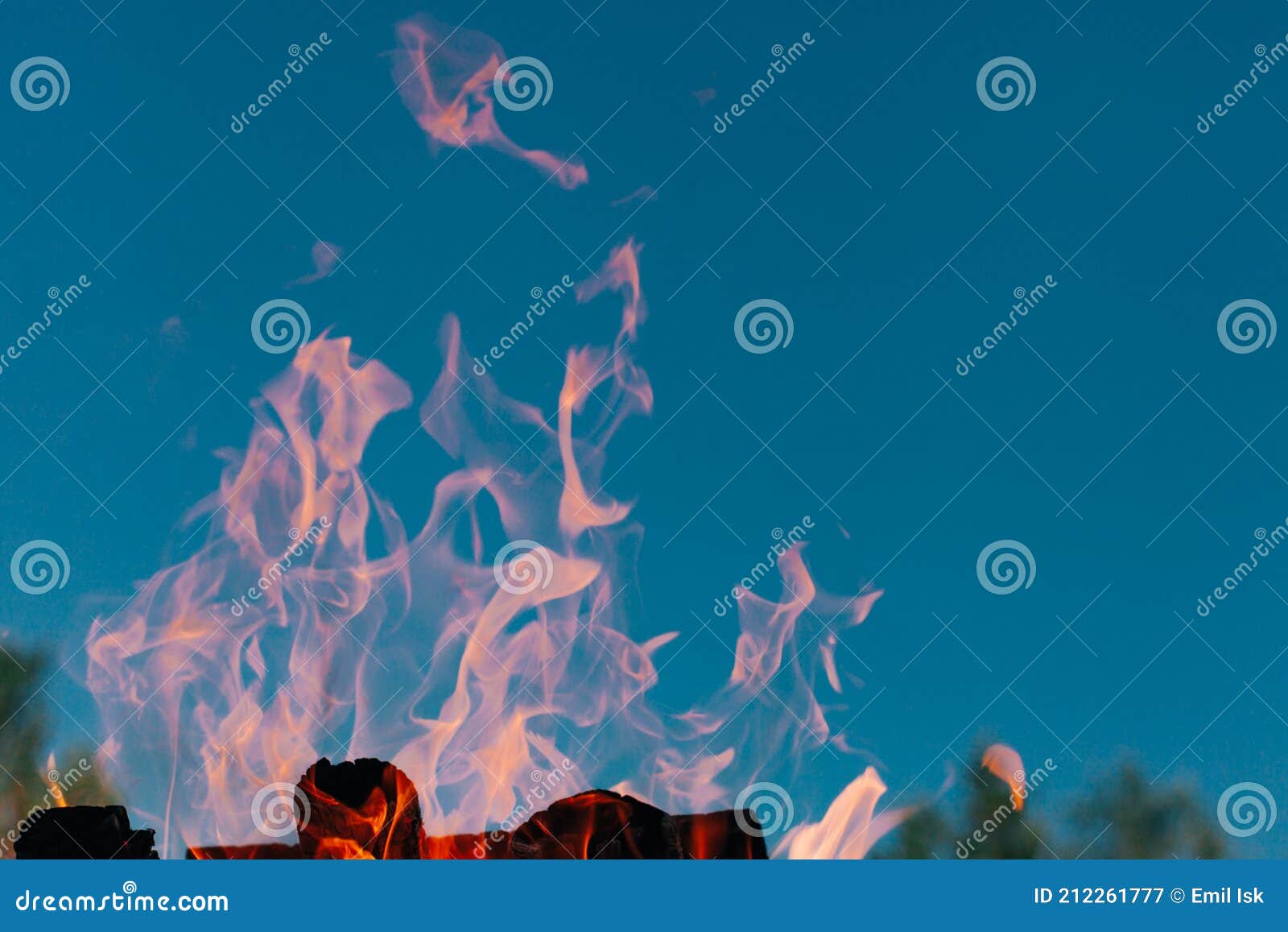 Flame of Campfire Outside with Blue Sky in Background. Bonfire Stock ...