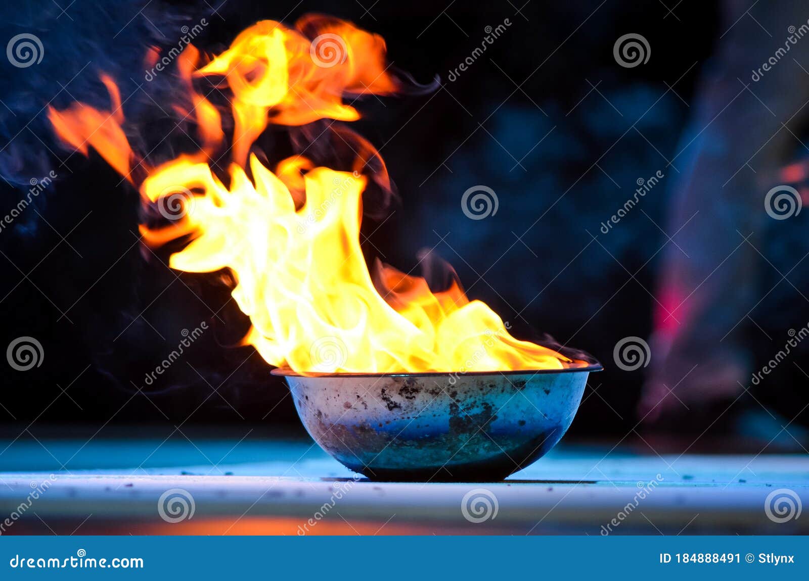 Flame in a fire bowl stock image. Image of light, hell - 184888491