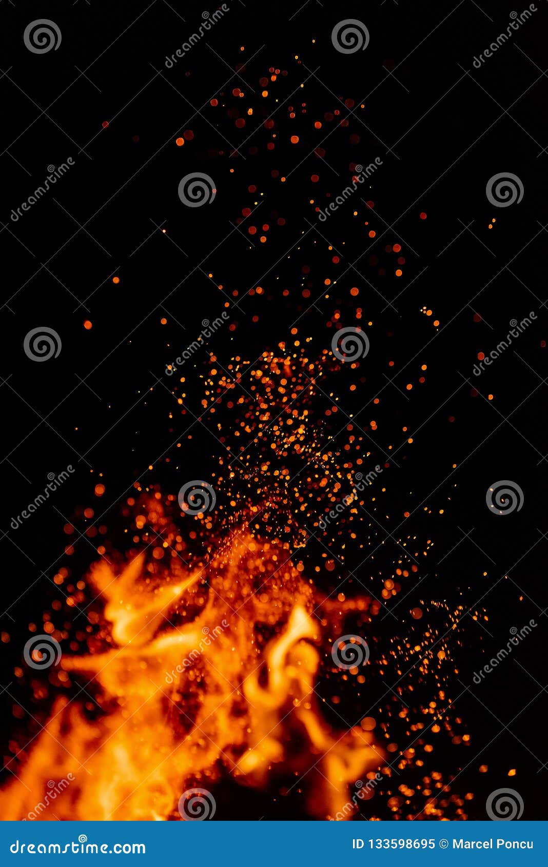 Flame of Fire with Sparks in the Air Over a Dark Night Stock Image ...