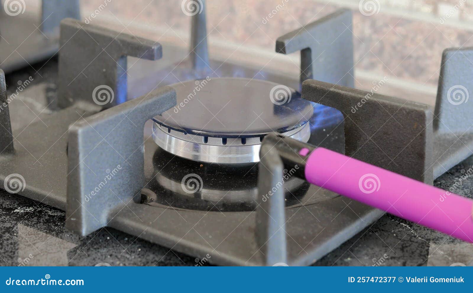 The Flame of a Gas Burner on a Stove in the Kitchen is Ignited by a ...