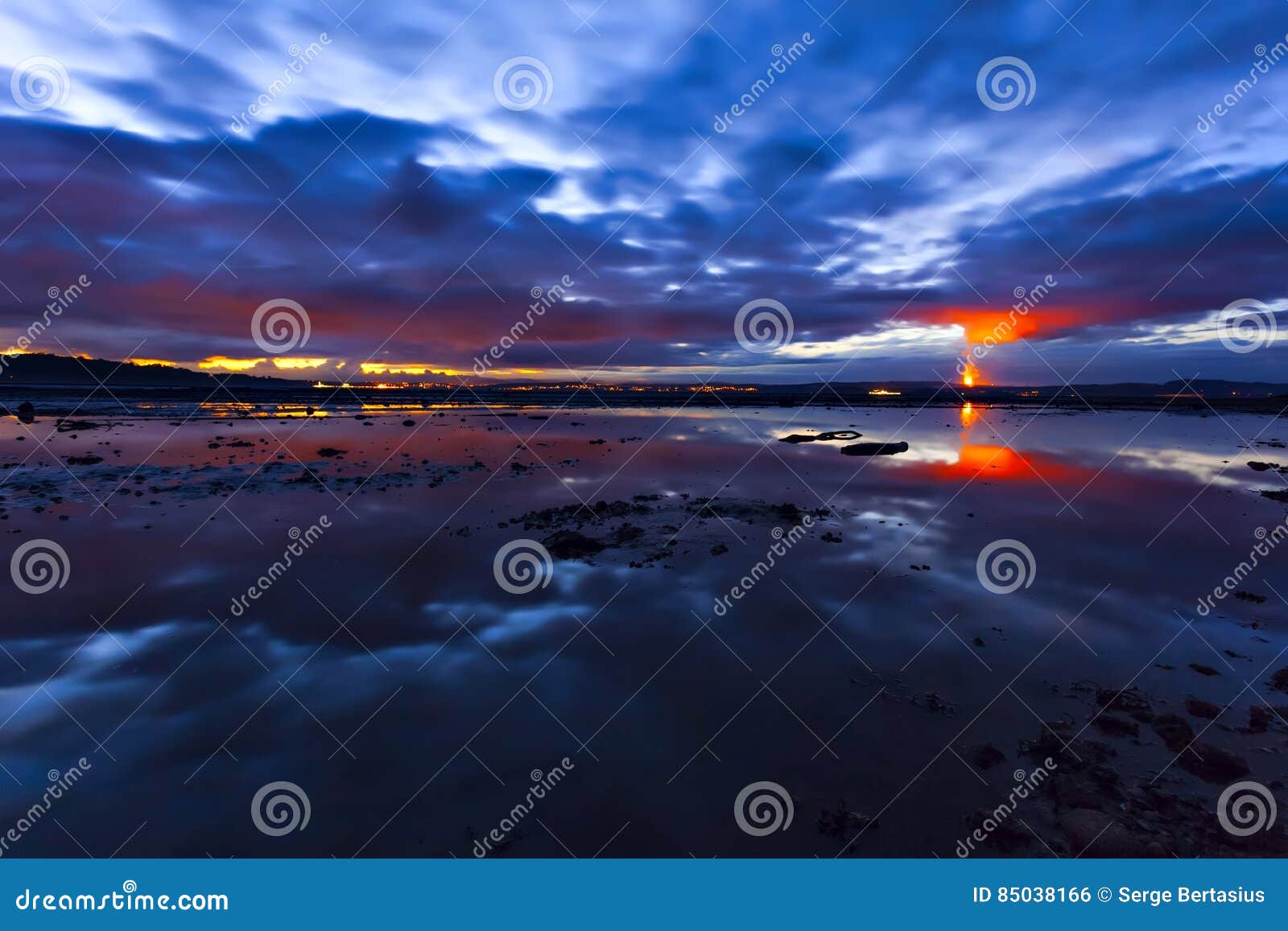 Flame on Horizon of Night Cloudscape Scene Over Water Surface Stock ...