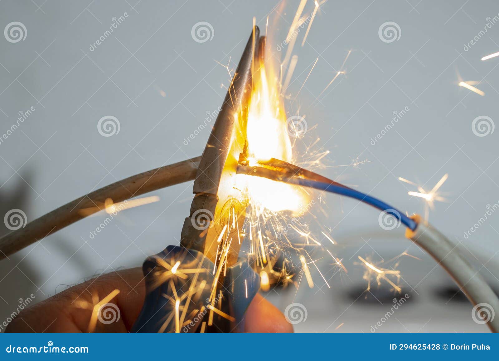 Flame and Sparks with Pliers Cutting Electrical Cables, Fire Hazard ...