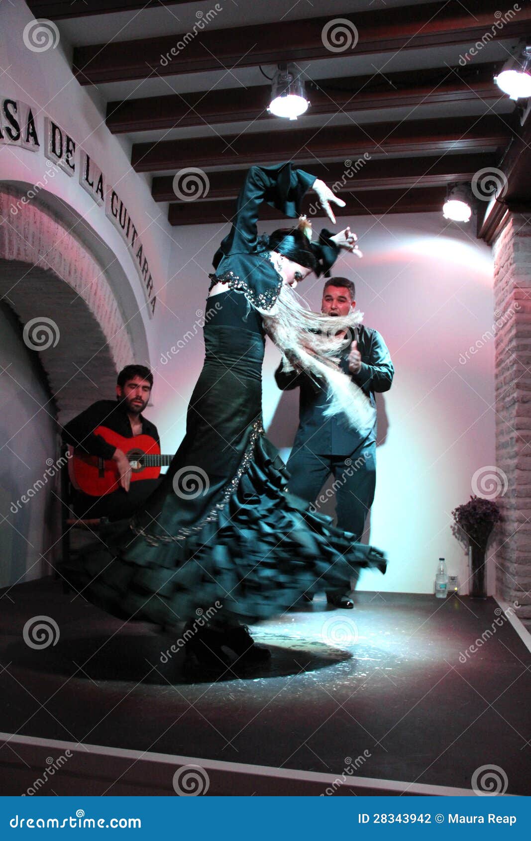 Flamenco Guitarist Playing Guitar In A Restaurant Among The Tables ...